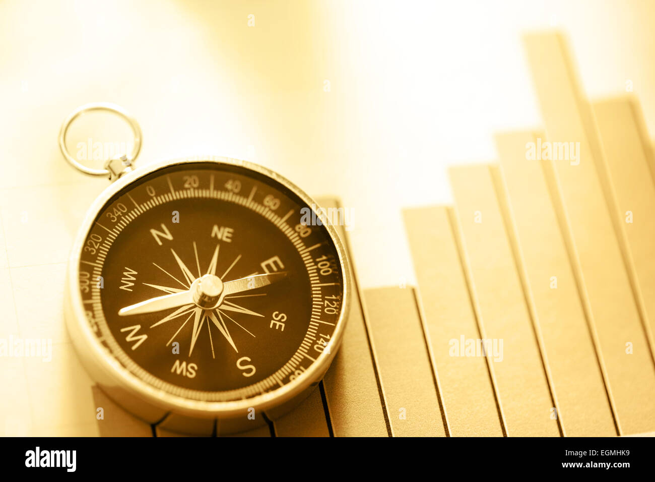 Diagram concept with compass and arrow in sepia toning Stock Photo - Alamy
