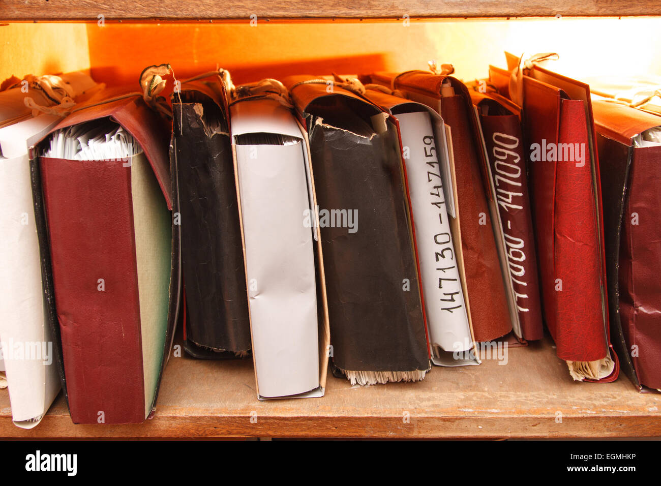 Paper documents stacked in archive on shelf Stock Photo - Alamy