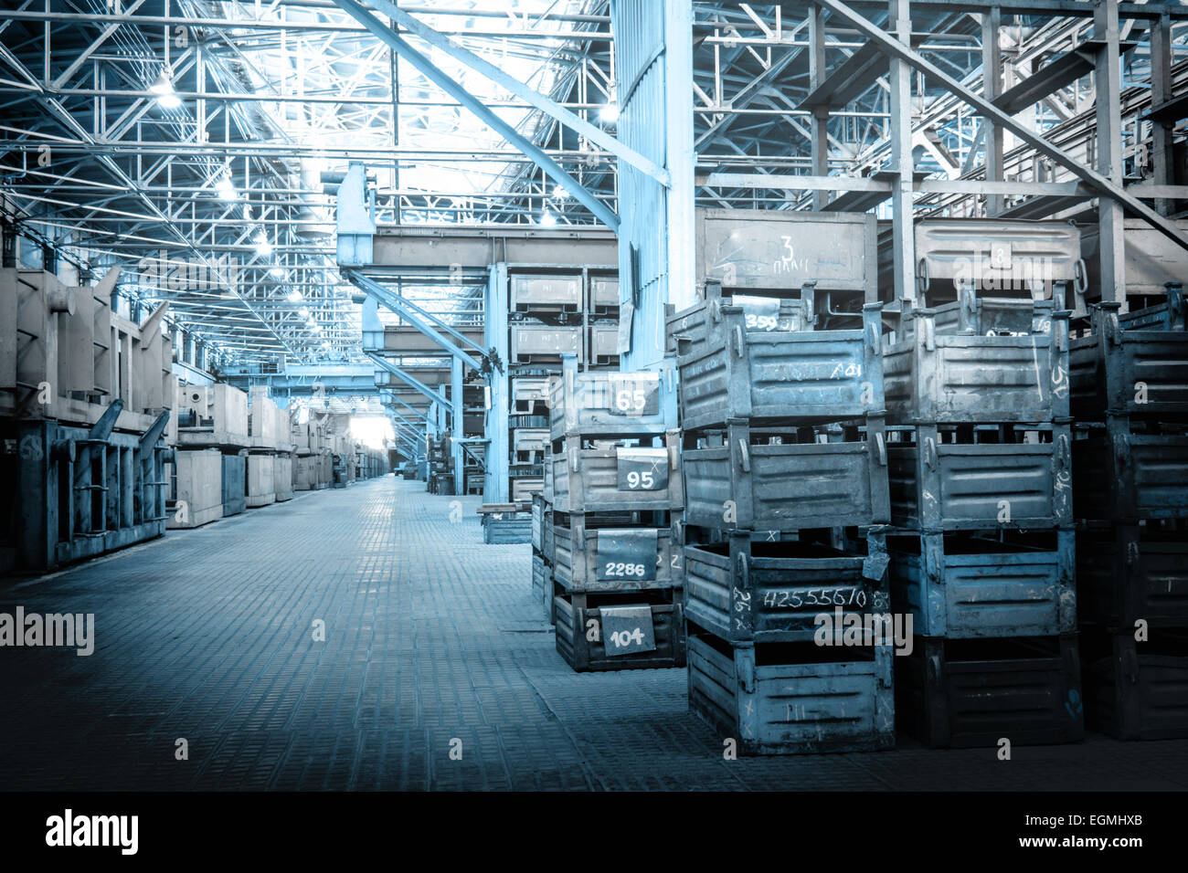 Big storage room with metal boxes in factory Stock Photo - Alamy