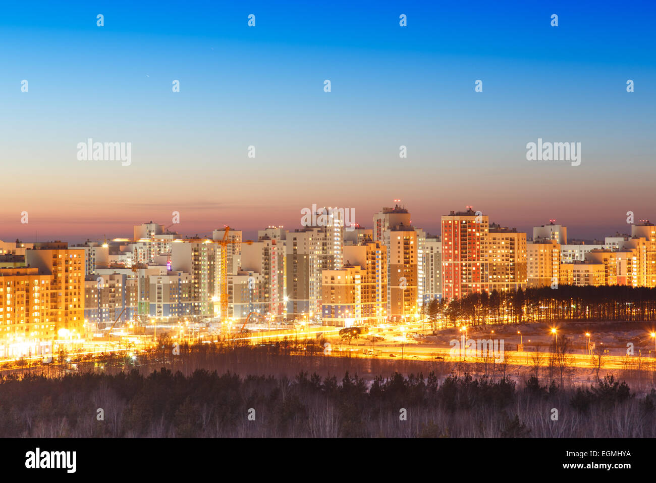 Sunset over city buildings view from above Stock Photo - Alamy
