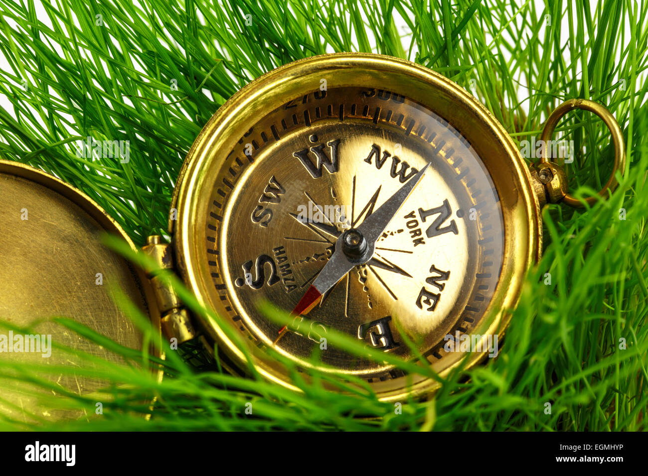 Vintage compass on fresh green grass closeup Stock Photo - Alamy