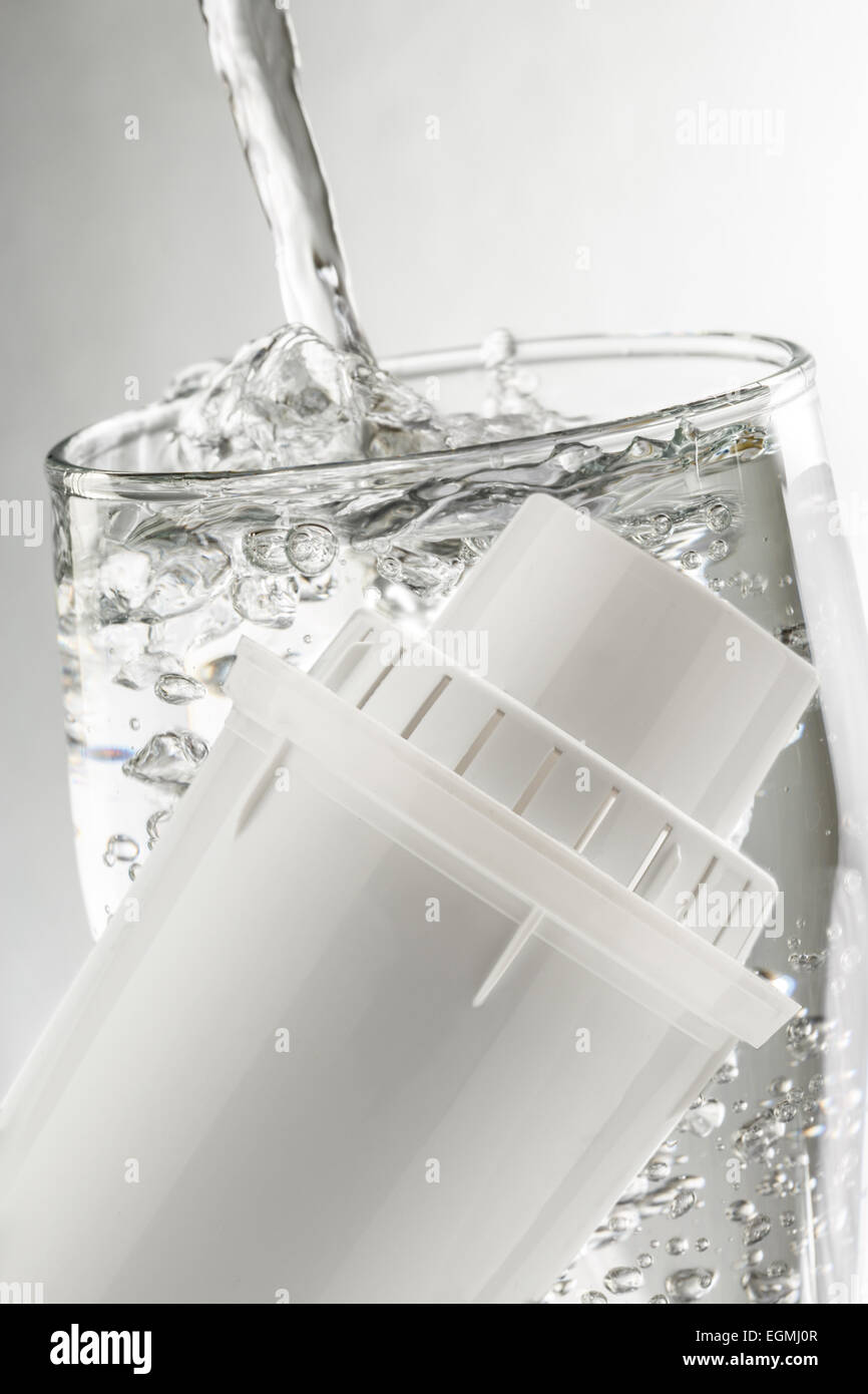 New water filter tube with glass on white background Stock Photo - Alamy