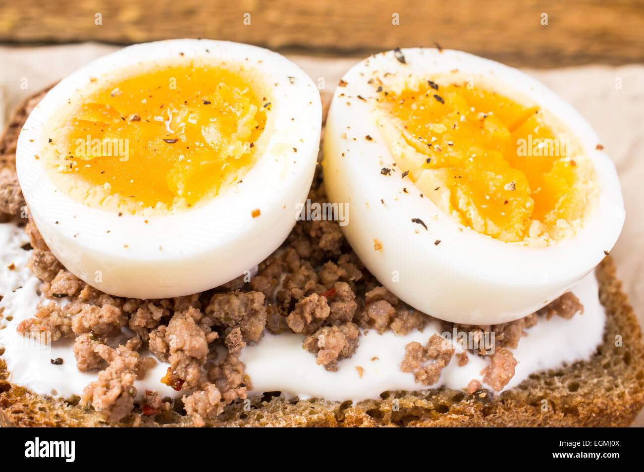 Sandwich with egg and minced meat for breakfast Stock Photo - Alamy