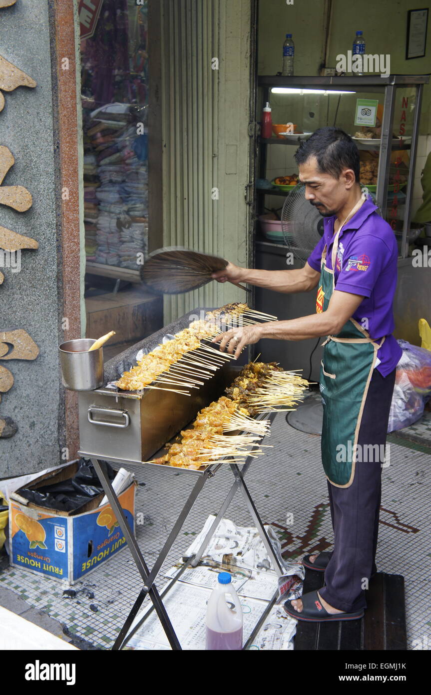 man barbequeing satay in Malaysia Stock Photo - Alamy