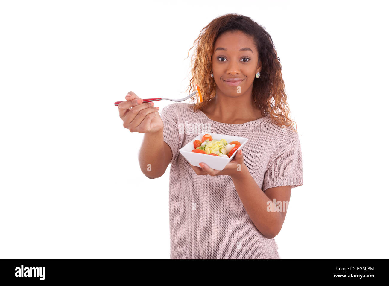 African American woman eating salad, isolated on white background Stock ...
