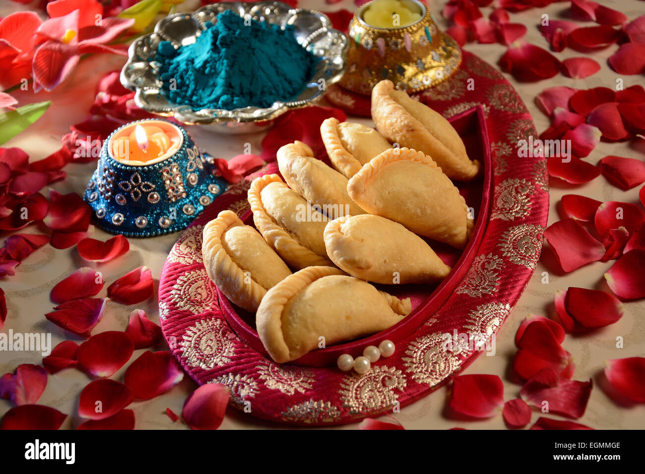 Gulaal & Gujia with candle light Stock Photo - Alamy