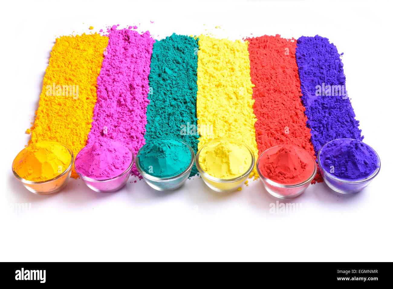 Heap of colorful gulaal in the bowls are leading to colorful strip of ...