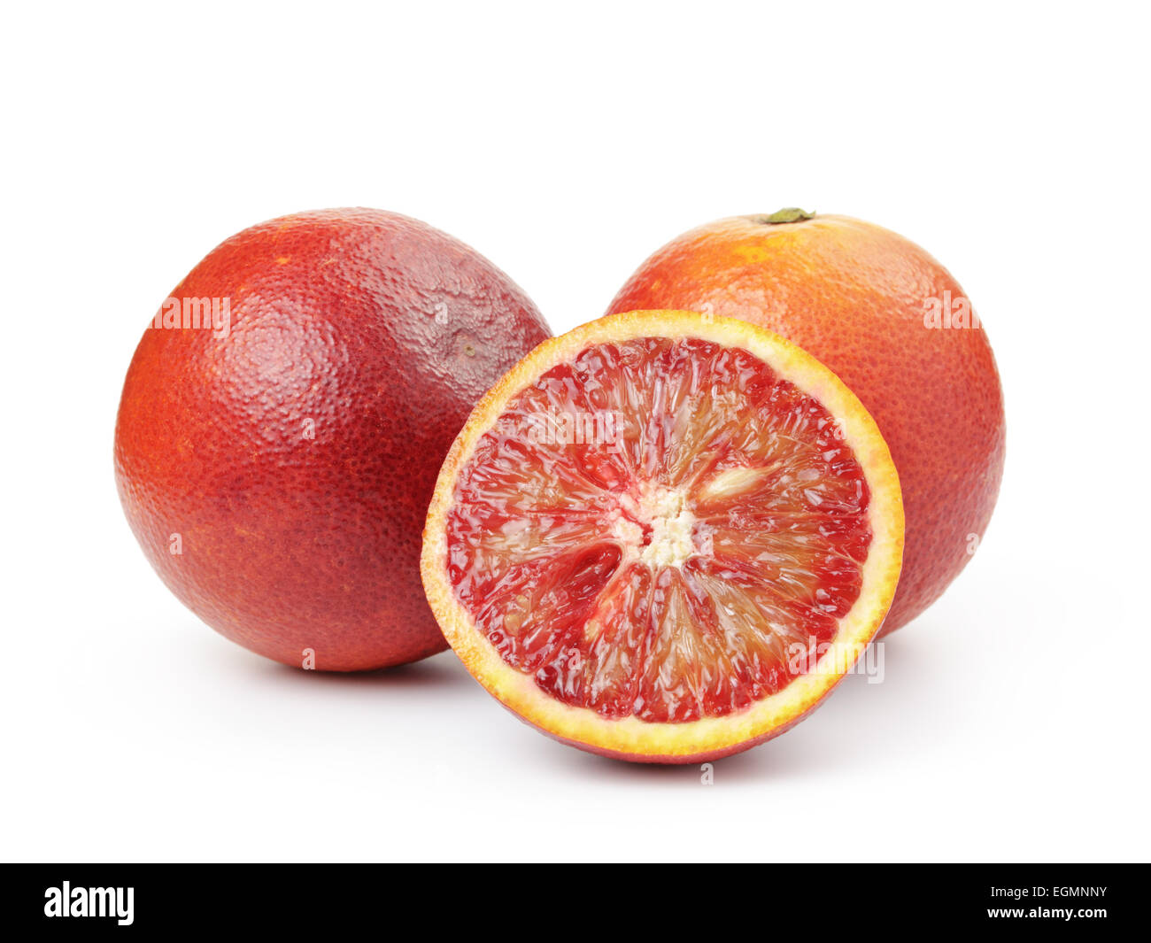 ripe blood red oranges with half isolated on white Stock Photo - Alamy