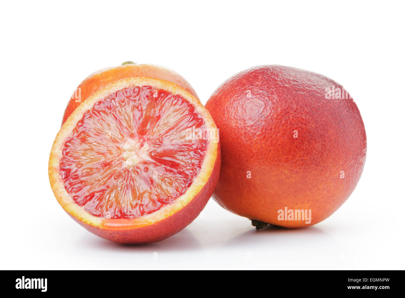 ripe blood red oranges with half isolated on white Stock Photo - Alamy
