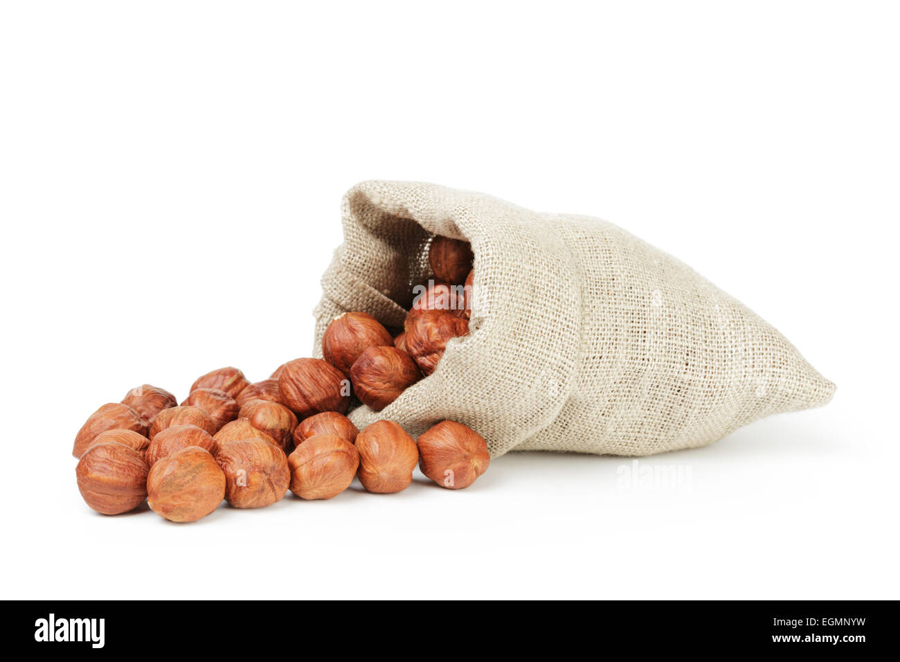 Fresh peeled hazelnuts in sack bag isolated Stock Photo - Alamy