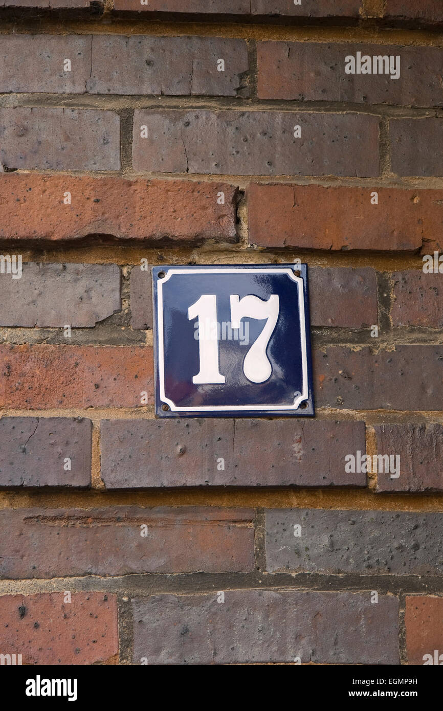 House number 17 on a brown brick wall Stock Photo - Alamy