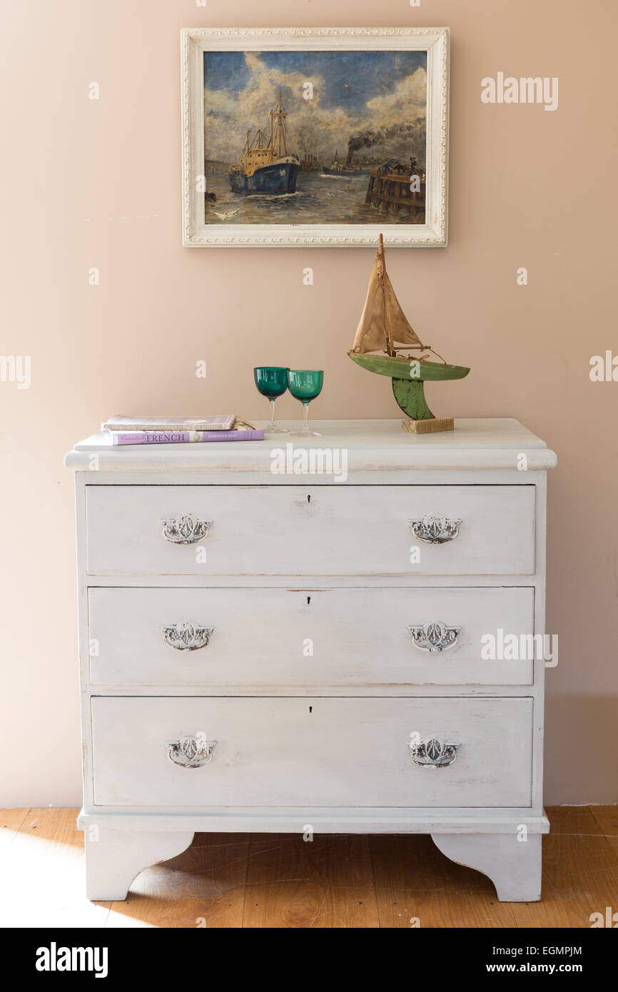 Simple wooden chest of drawers with vintage items Stock Photo - Alamy
