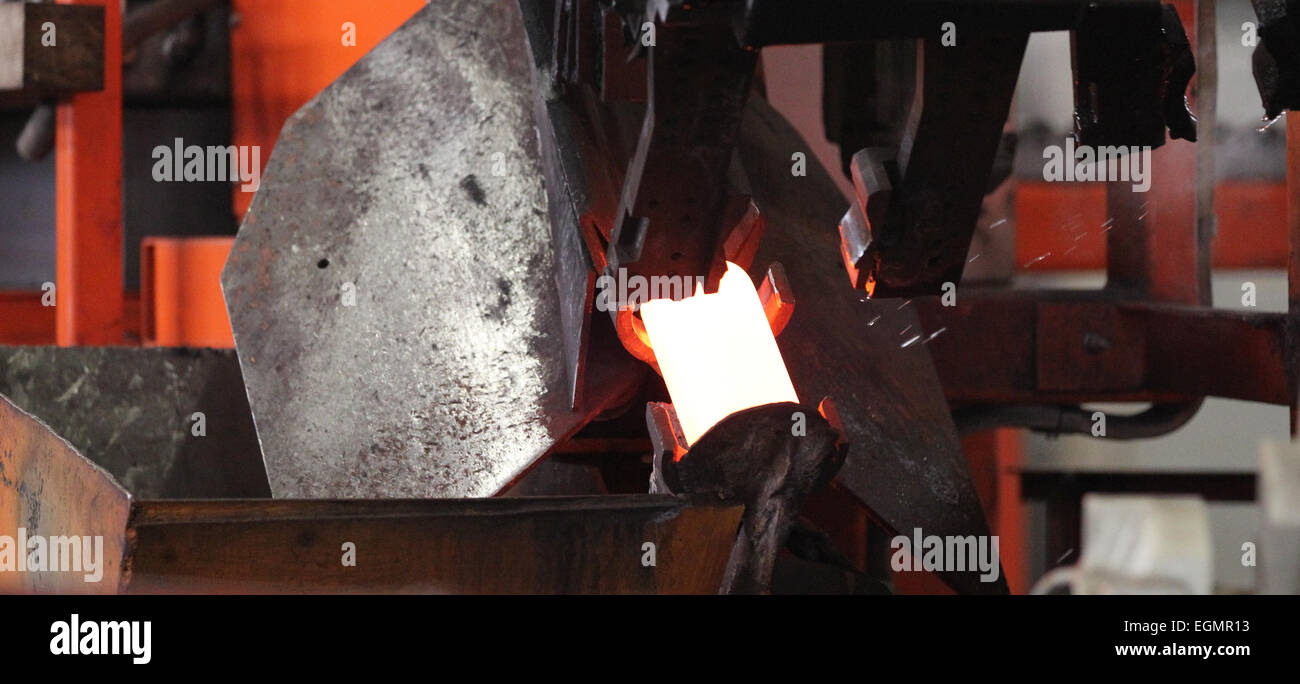 positioning unit and supplying the heated round billet Stock Photo - Alamy