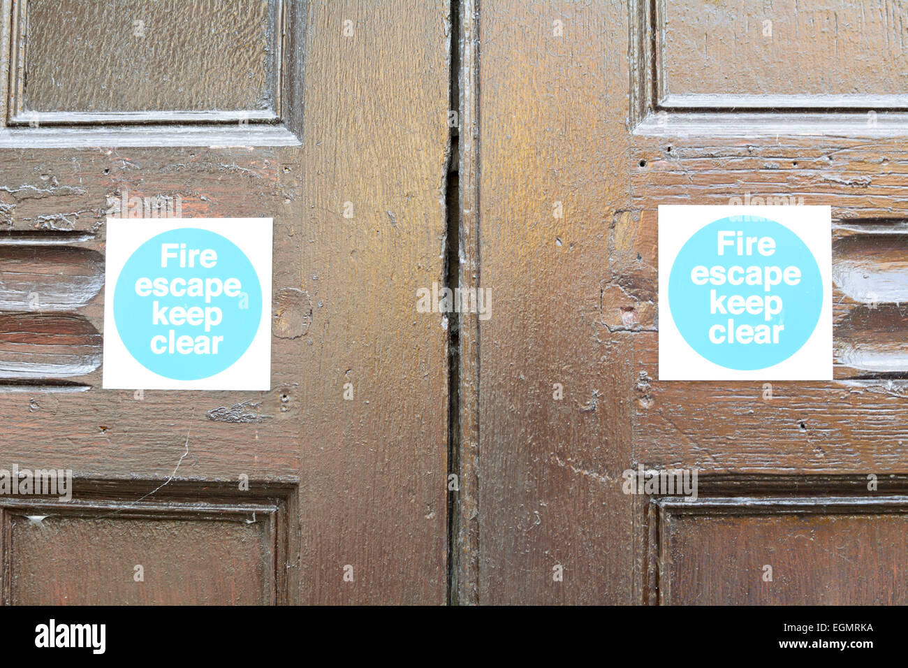 Fire escape stickers on double doors - keep clear Stock Photo - Alamy