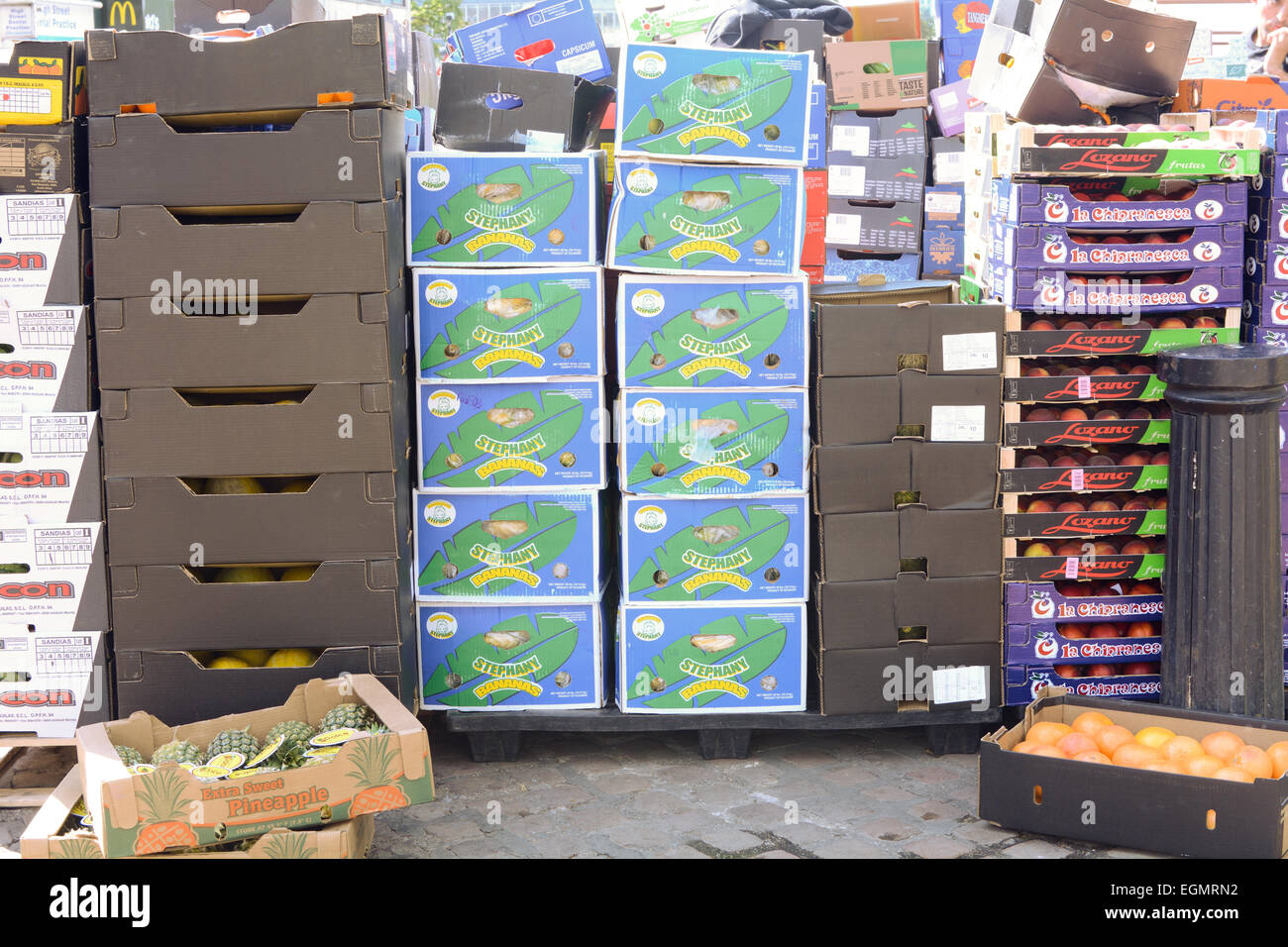Fruit and vegetable boxes stacked at market stalls at bi-weekly open ...