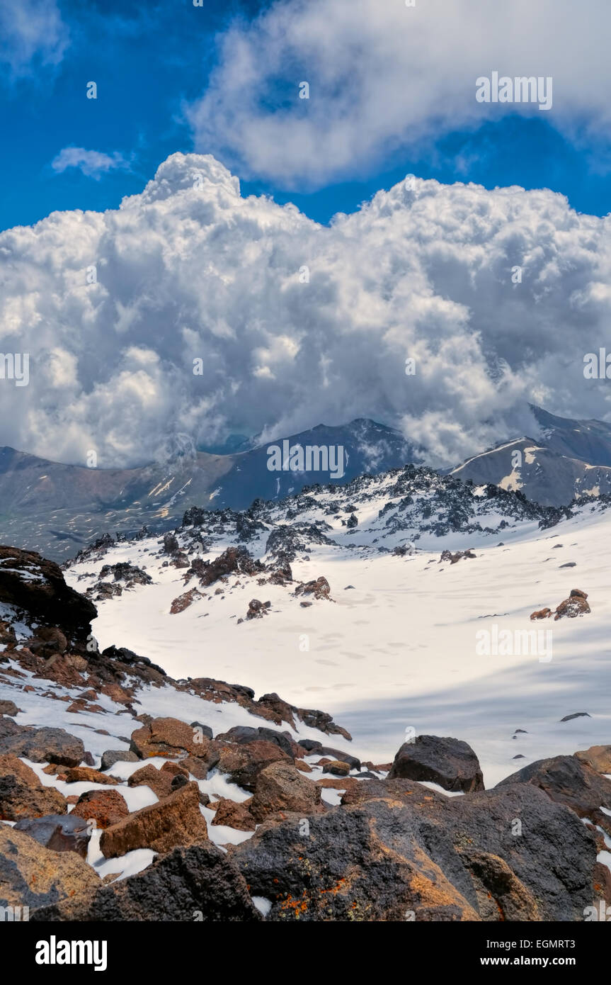 Stormy clouds forming over the top of mountains around Sabalan volcano ...