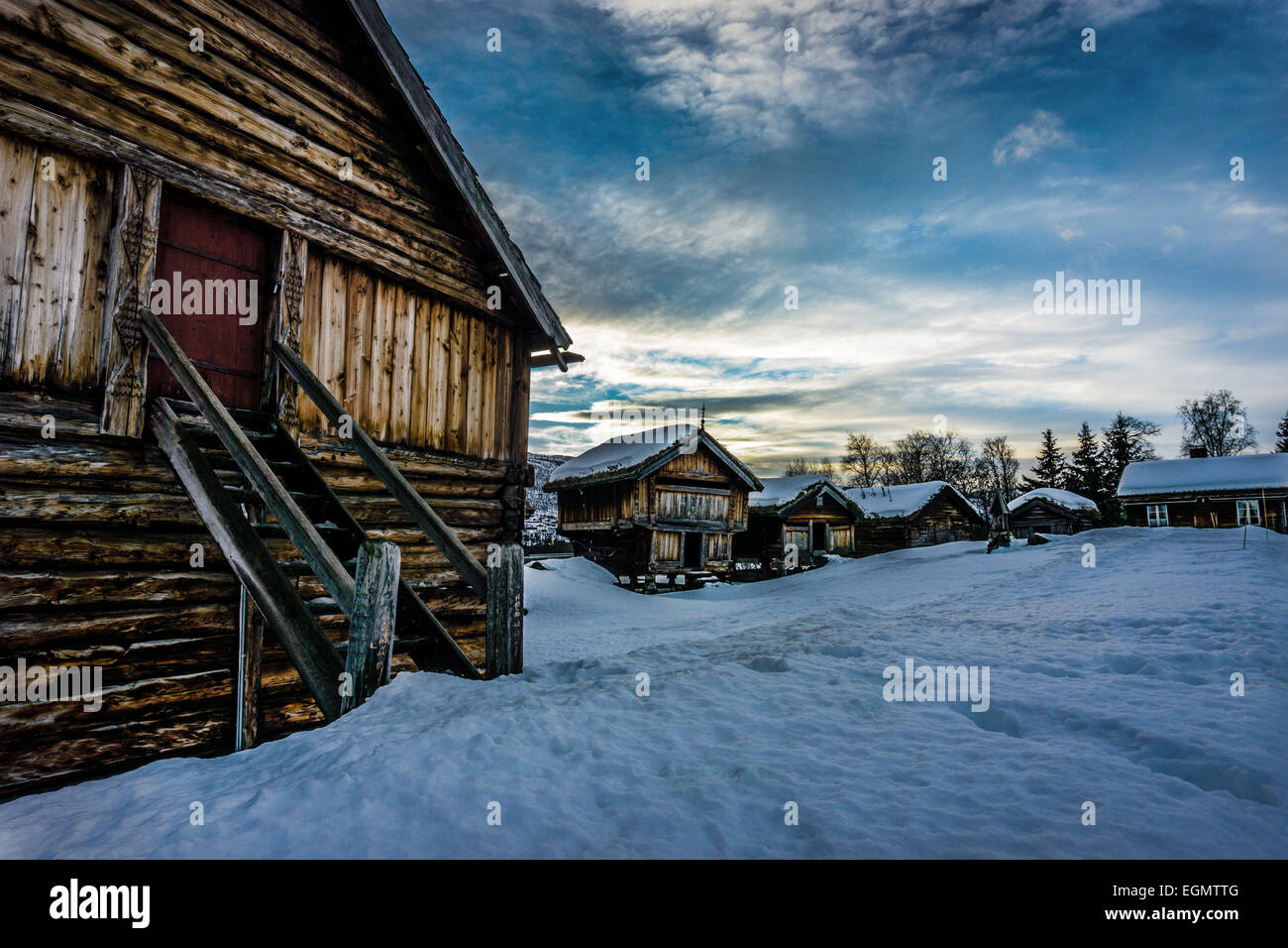 Old traditional Norwegian farm houses. December sunset at an open air ...