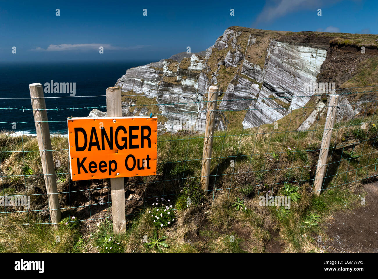 Warning sign on the edge of high cliffs in County Kerry, Republic of ...