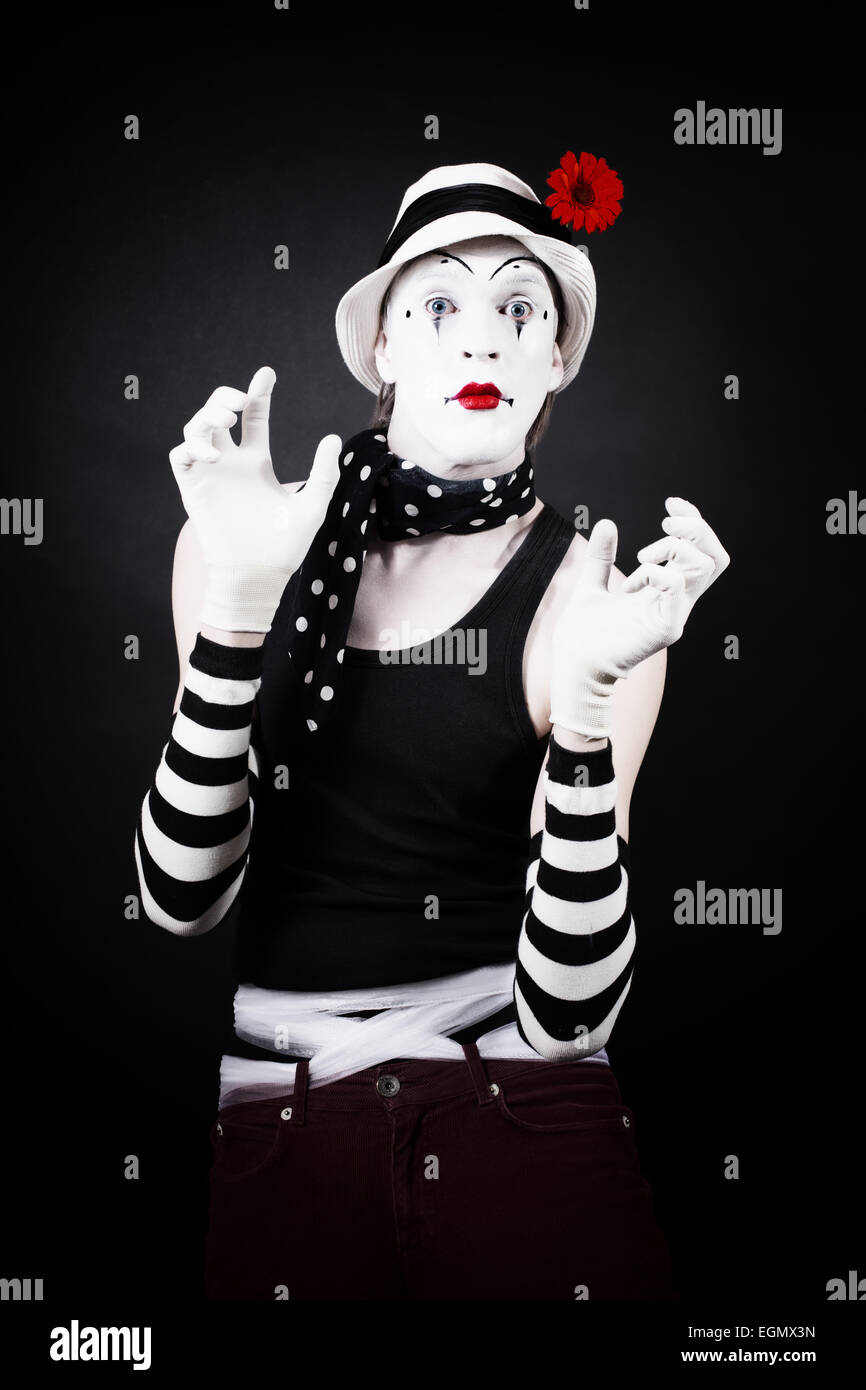 Portrait of a cheerful mime on a black background Stock Photo - Alamy