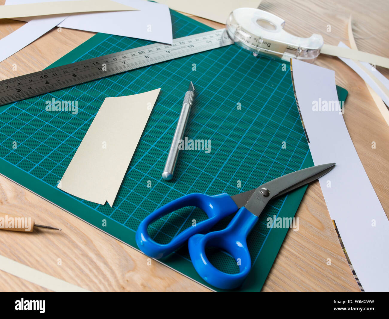 Assorted paper craft implements, scissors, ruler, pen knife and cutting ...