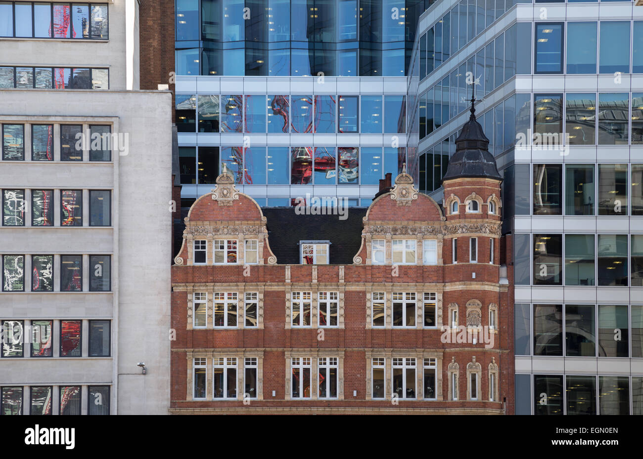 Victorian building hemmed in on either side by modern office blocks on ...