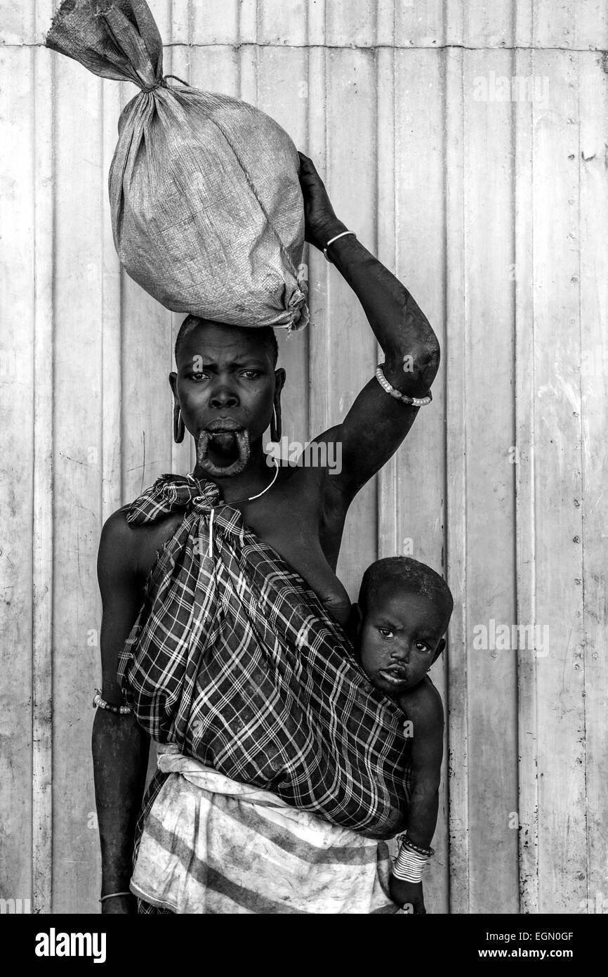Portrait Of A Woman and Baby From The Mursi Tribe, Jinka Town, Omo ...
