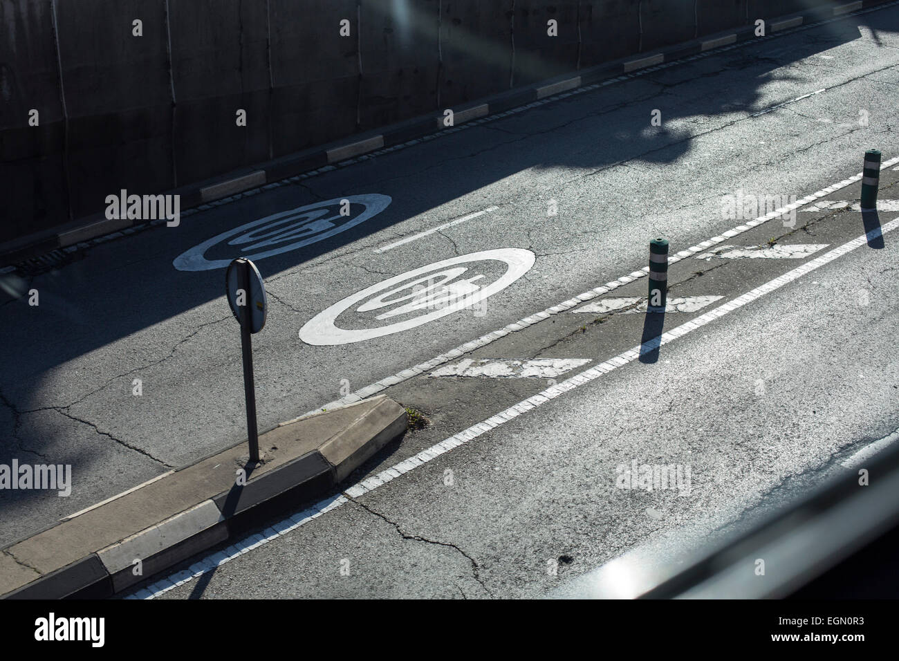 Road shadow 40 kph speed limit main road Stock Photo - Alamy