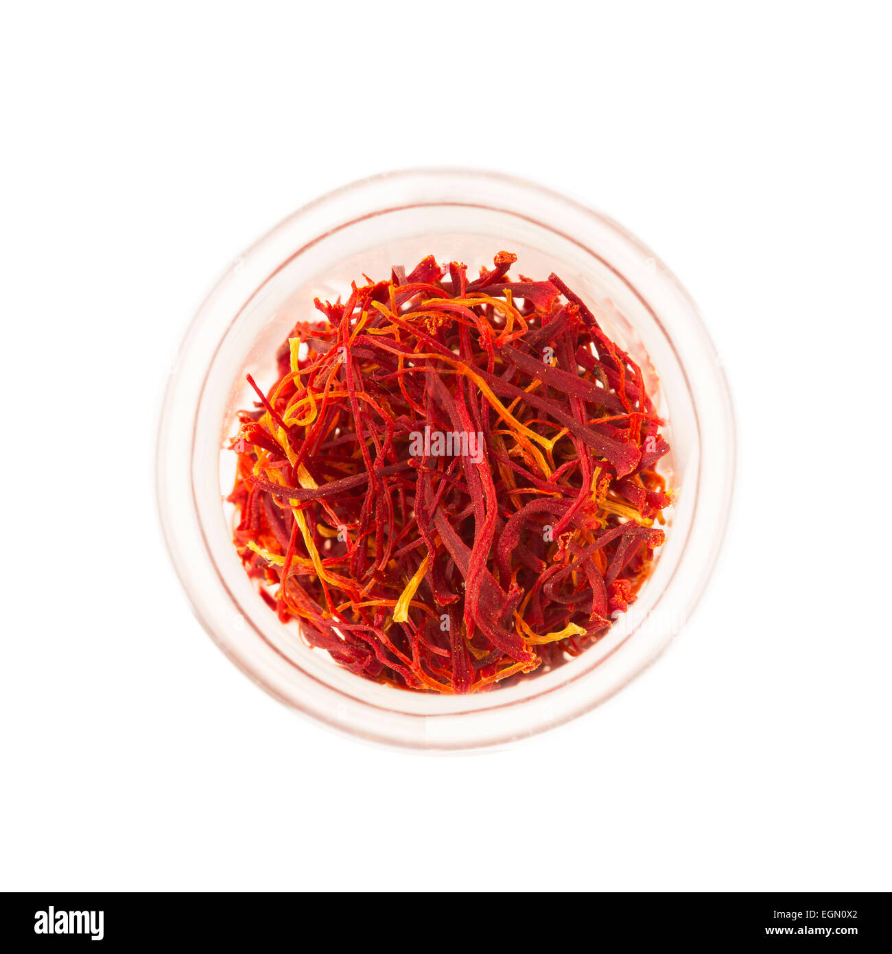 Saffron in glass container from above and isolated on white Stock Photo ...