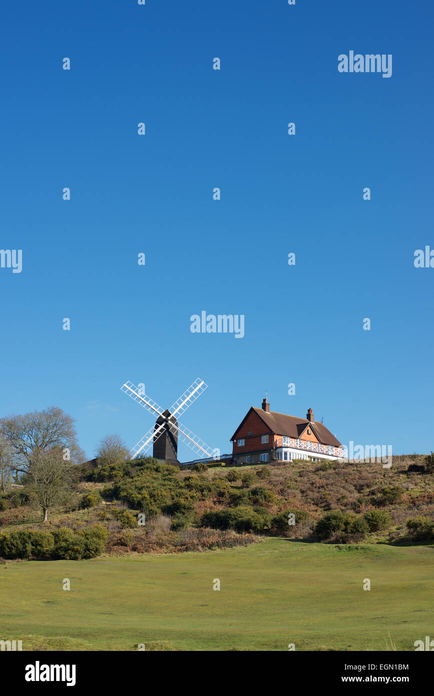 A blue anticyclonic sky with a windmill, Gorse (Ulex Europaeus ...