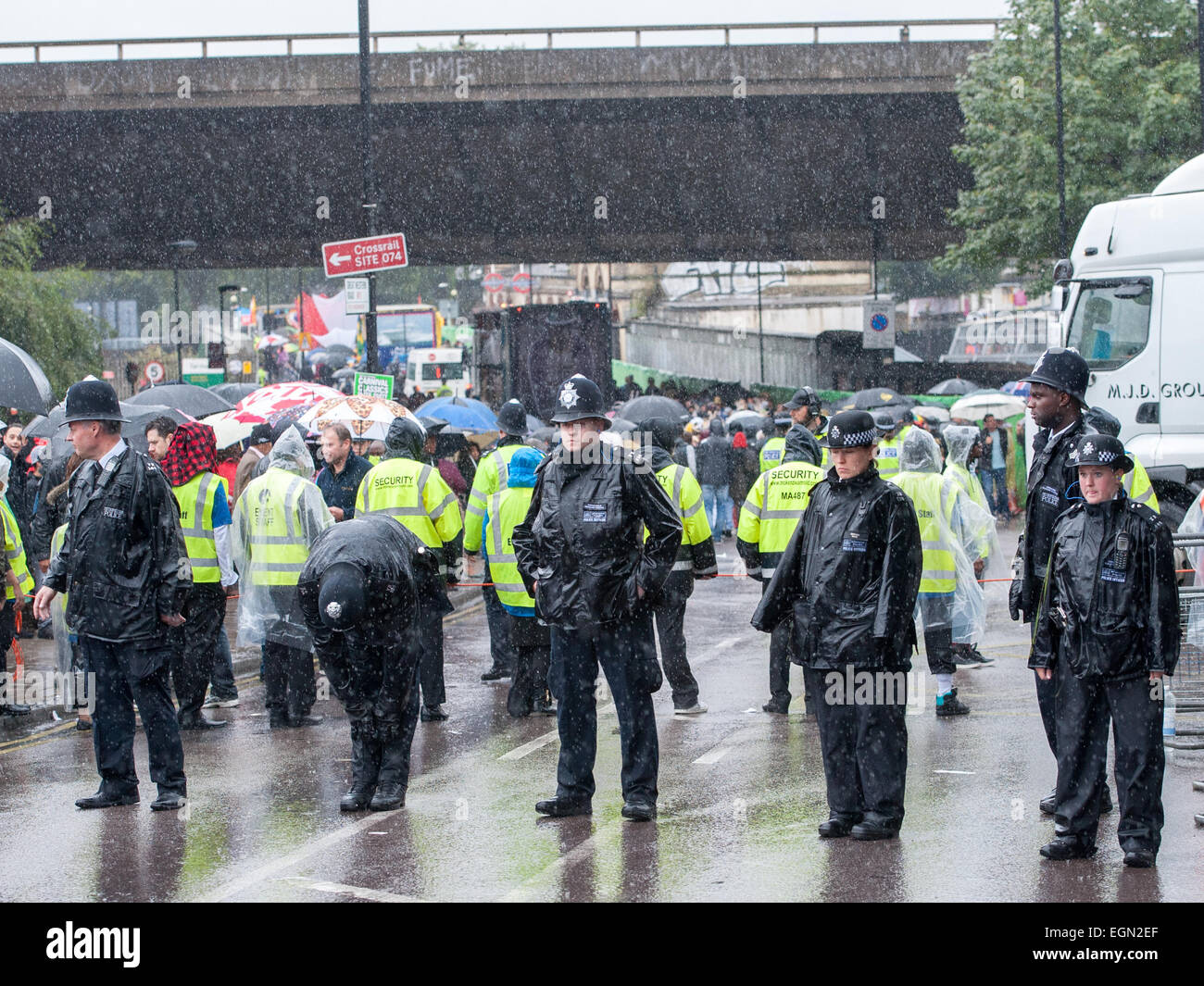 Police officers in rain hi-res stock photography and images - Alamy