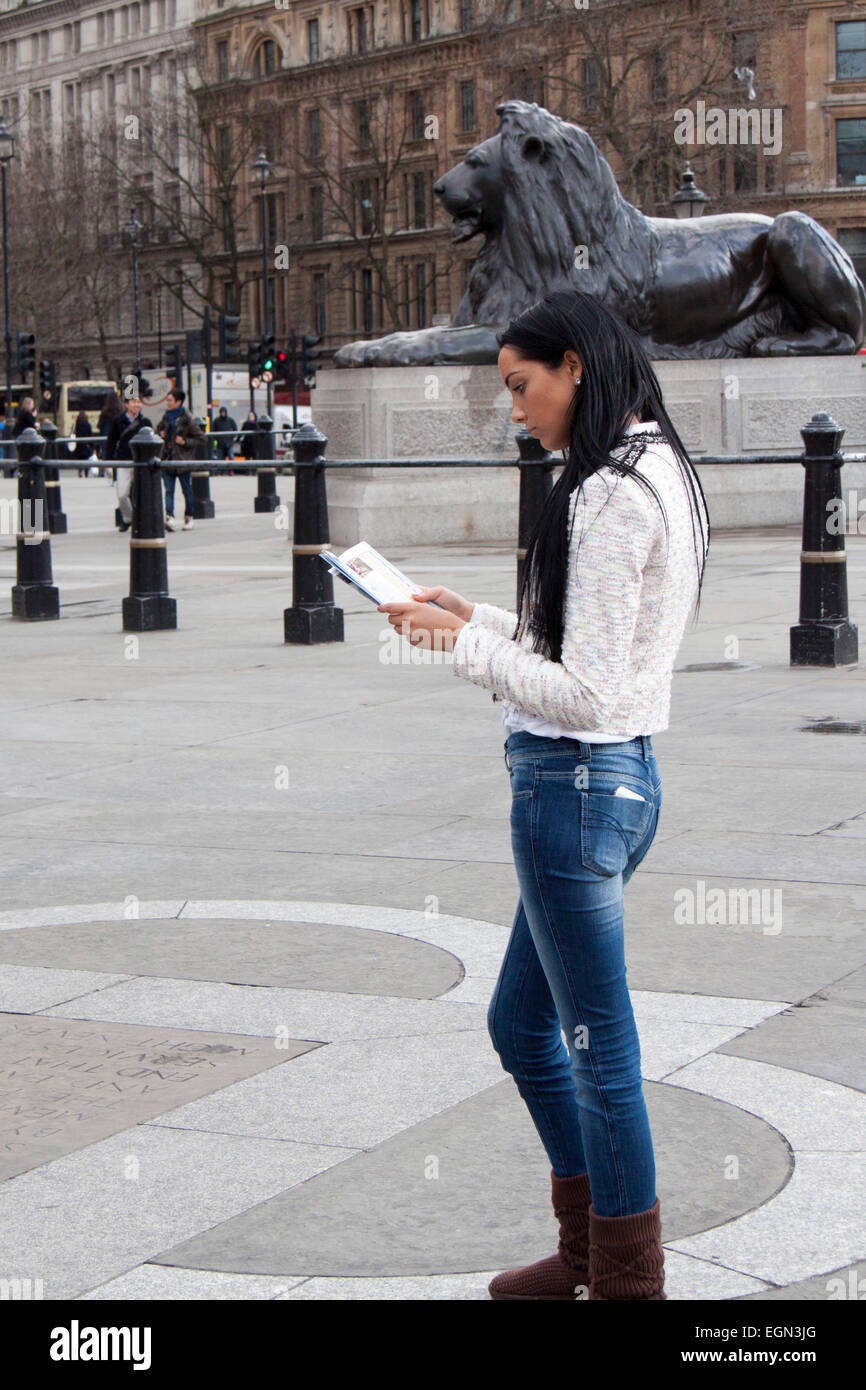 Reading a guide book hi-res stock photography and images - Alamy