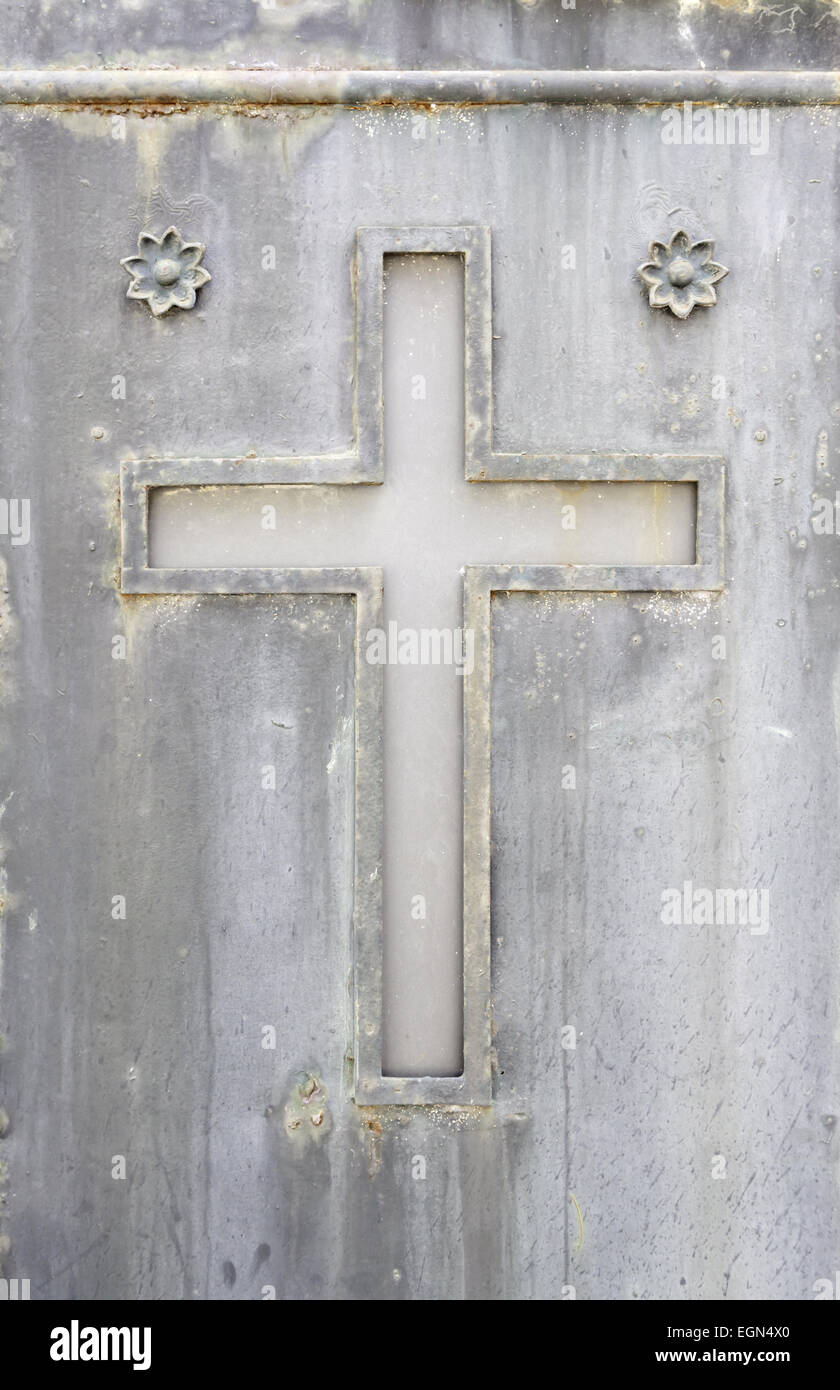 Old rusty metal cross, detail of an old cross on a metal wall, cemetery ...