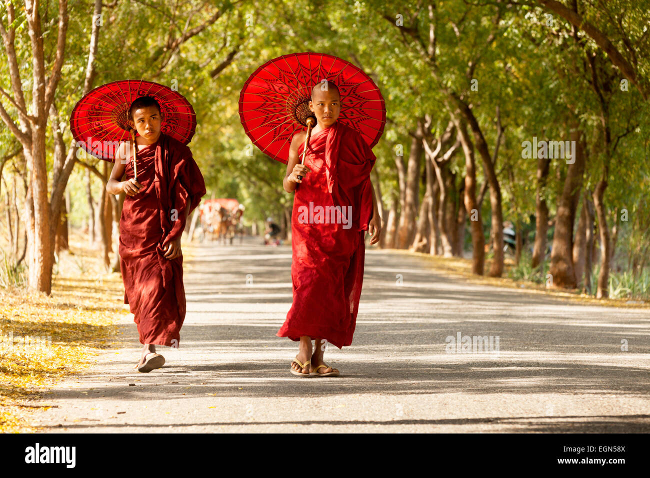Two burmese buddhist monks walking along a road, Bagan, Myanmar ( Burma ...