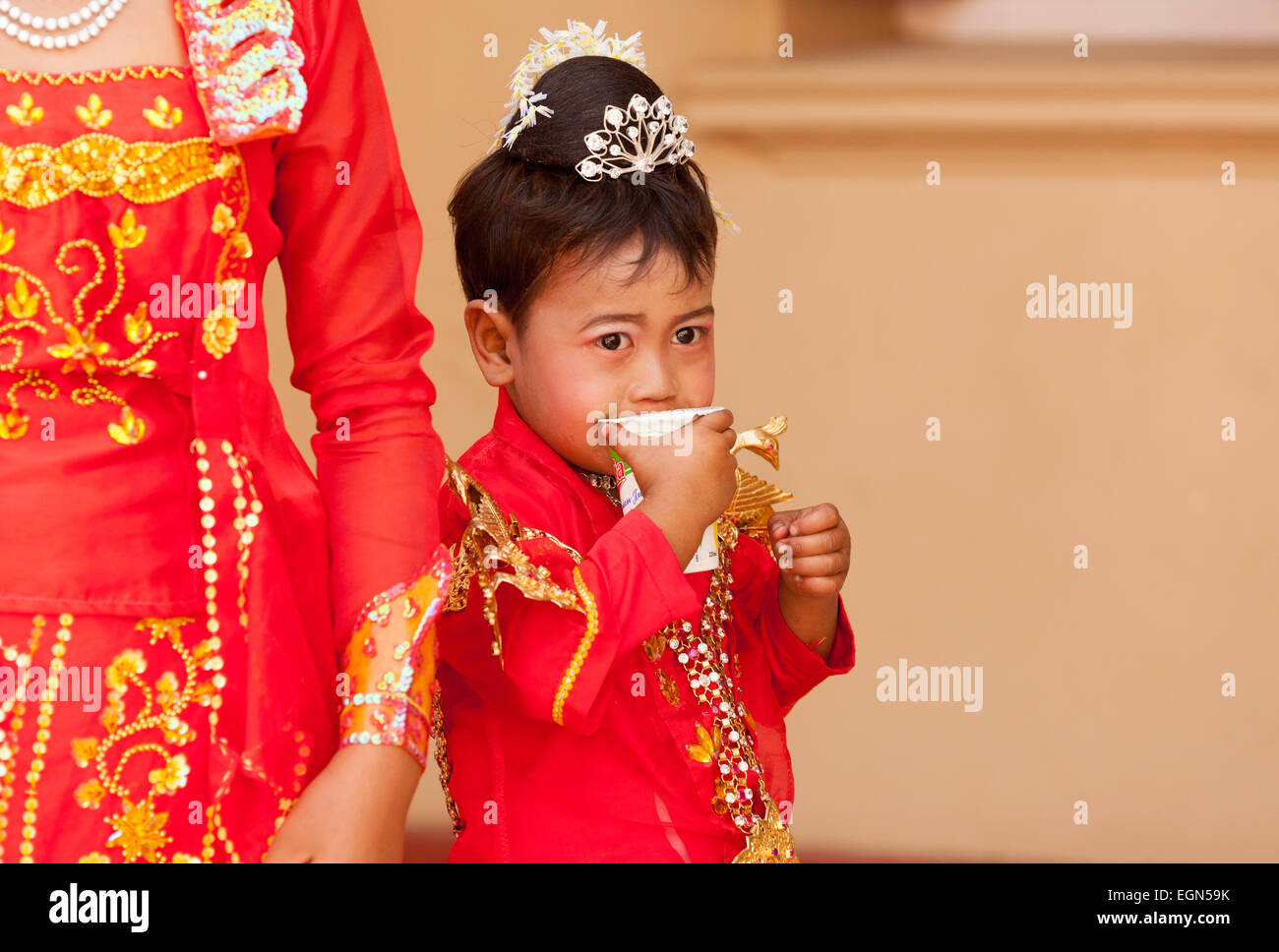 A young boy in religious buddhist ceremonial dress, Mandalay, Myanmar ...