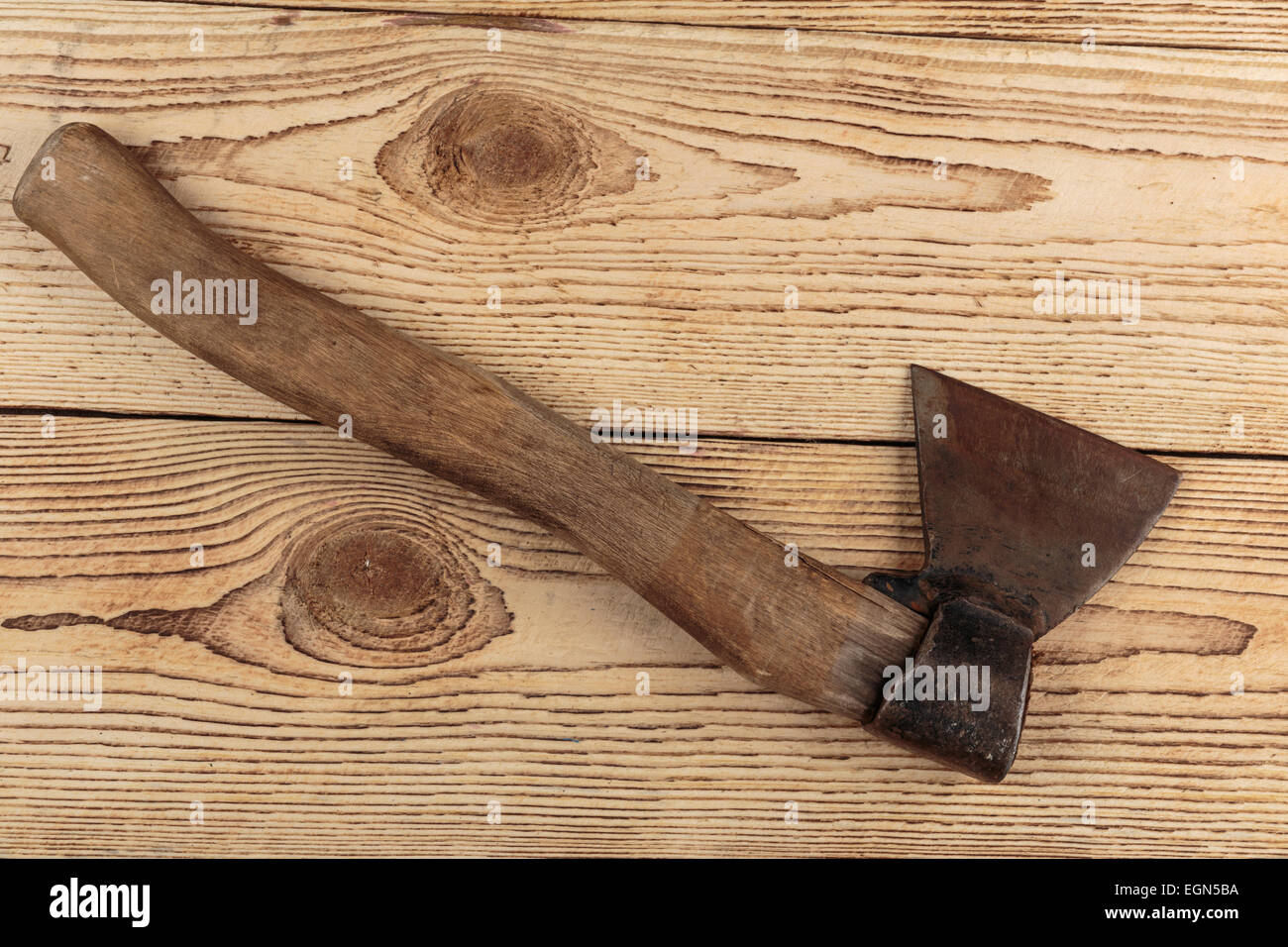Old Axe on a wooden background Stock Photo - Alamy