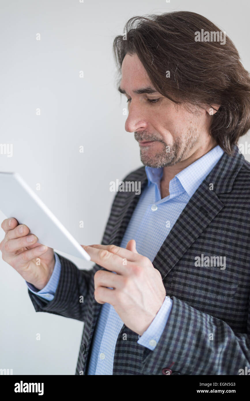 man with the tablet in his hands Stock Photo - Alamy