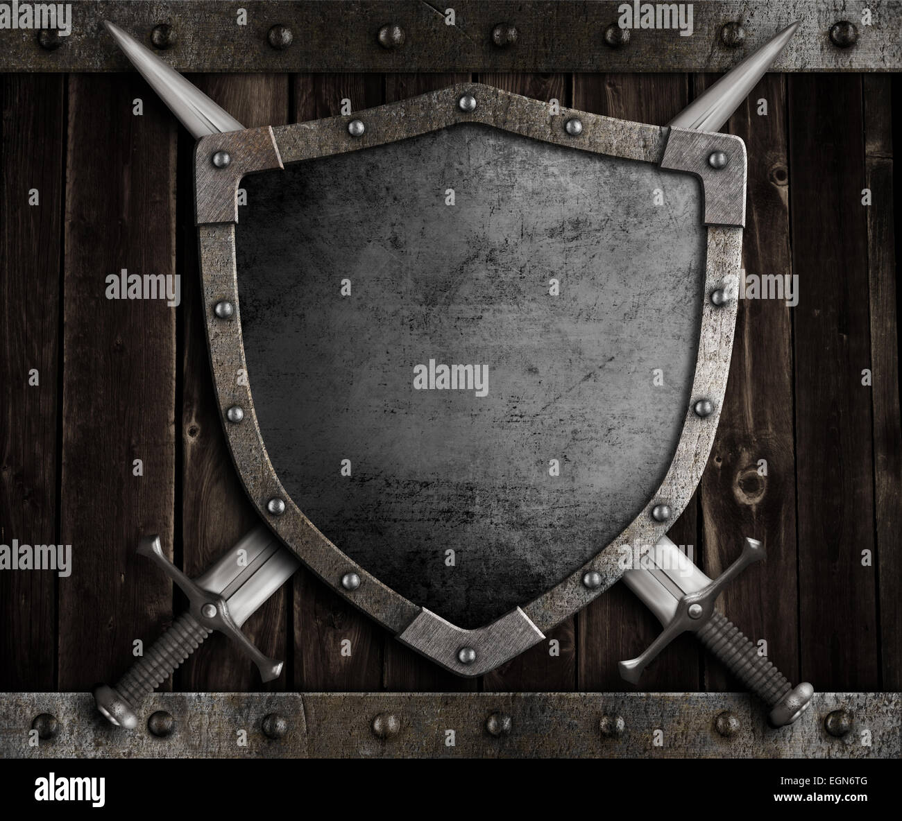 medieval knight shield and crossed swords on wooden gate Stock Photo ...
