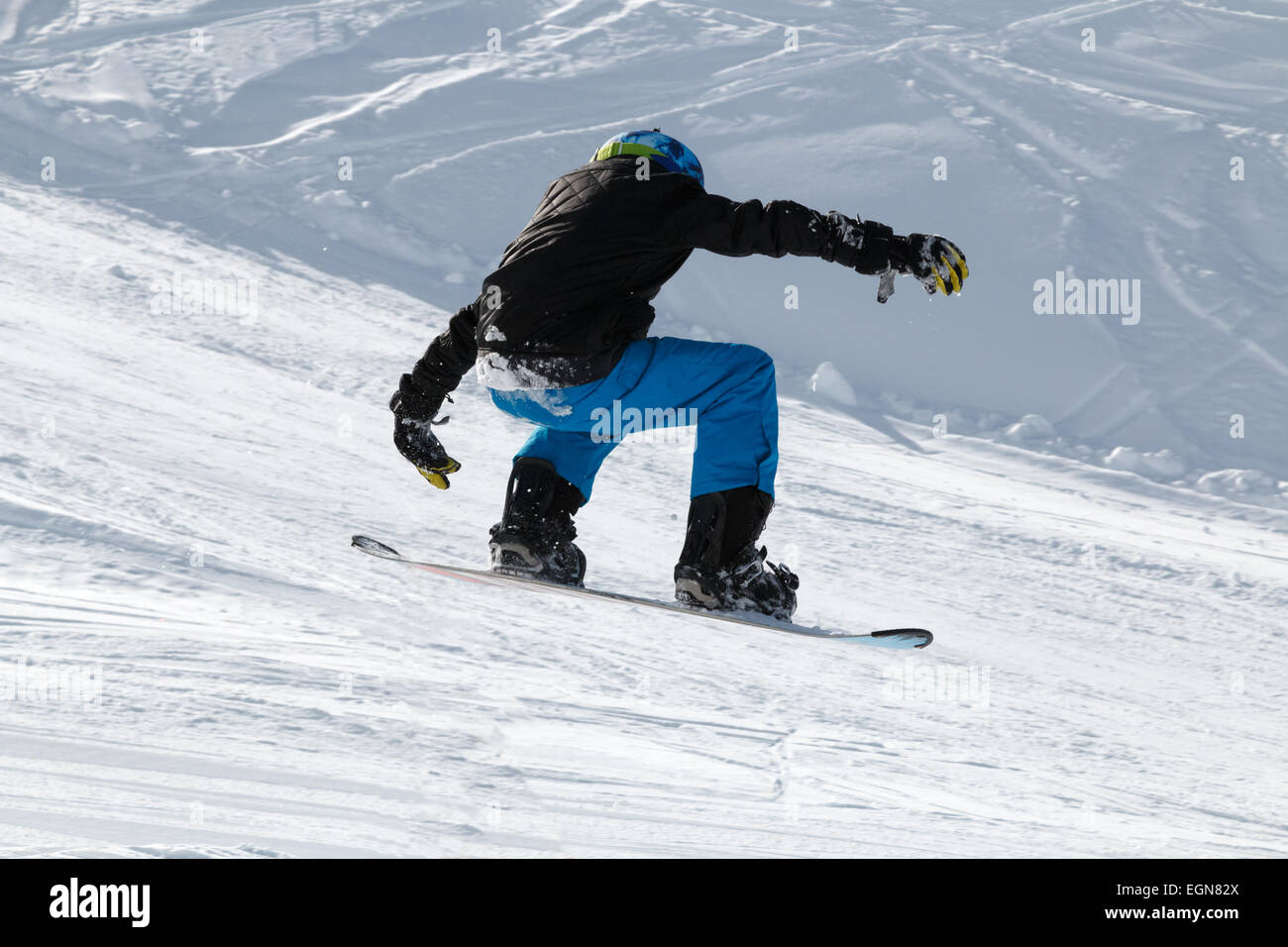 Boy snowboarder freestyle jumping Stock Photo - Alamy
