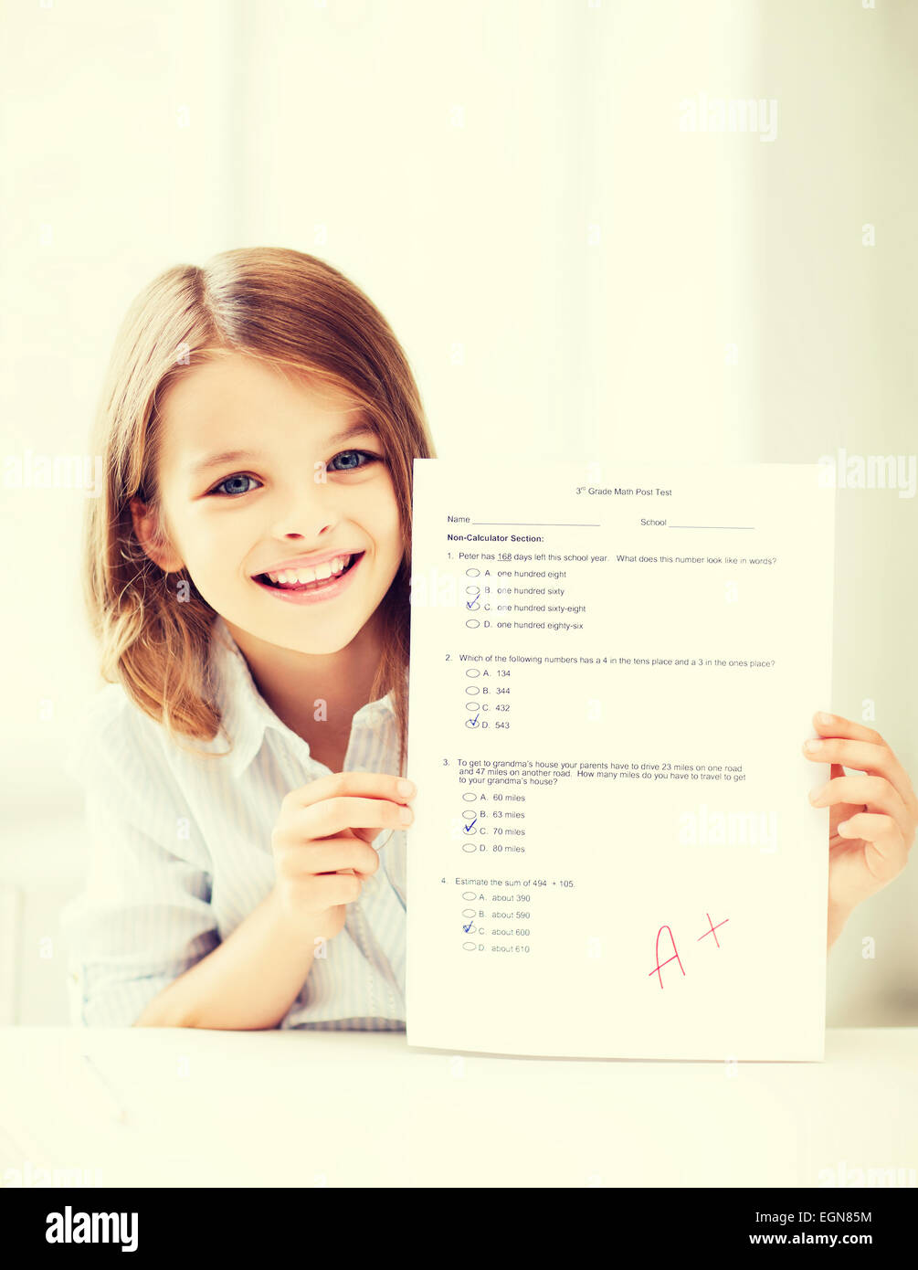 girl with test and grade at school Stock Photo - Alamy