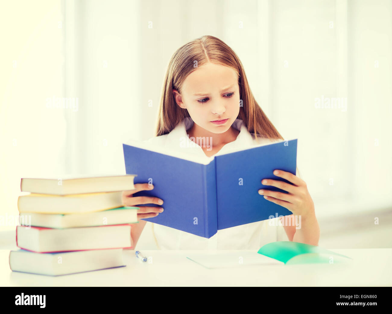 girl studying and reading book at school Stock Photo - Alamy