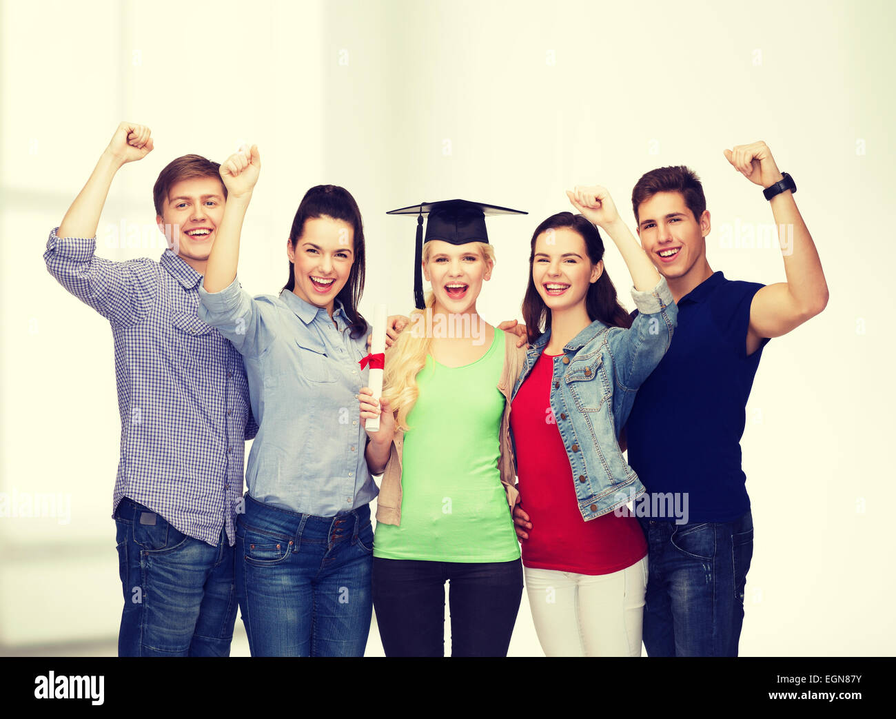 group of standing smiling students with diploma Stock Photo - Alamy