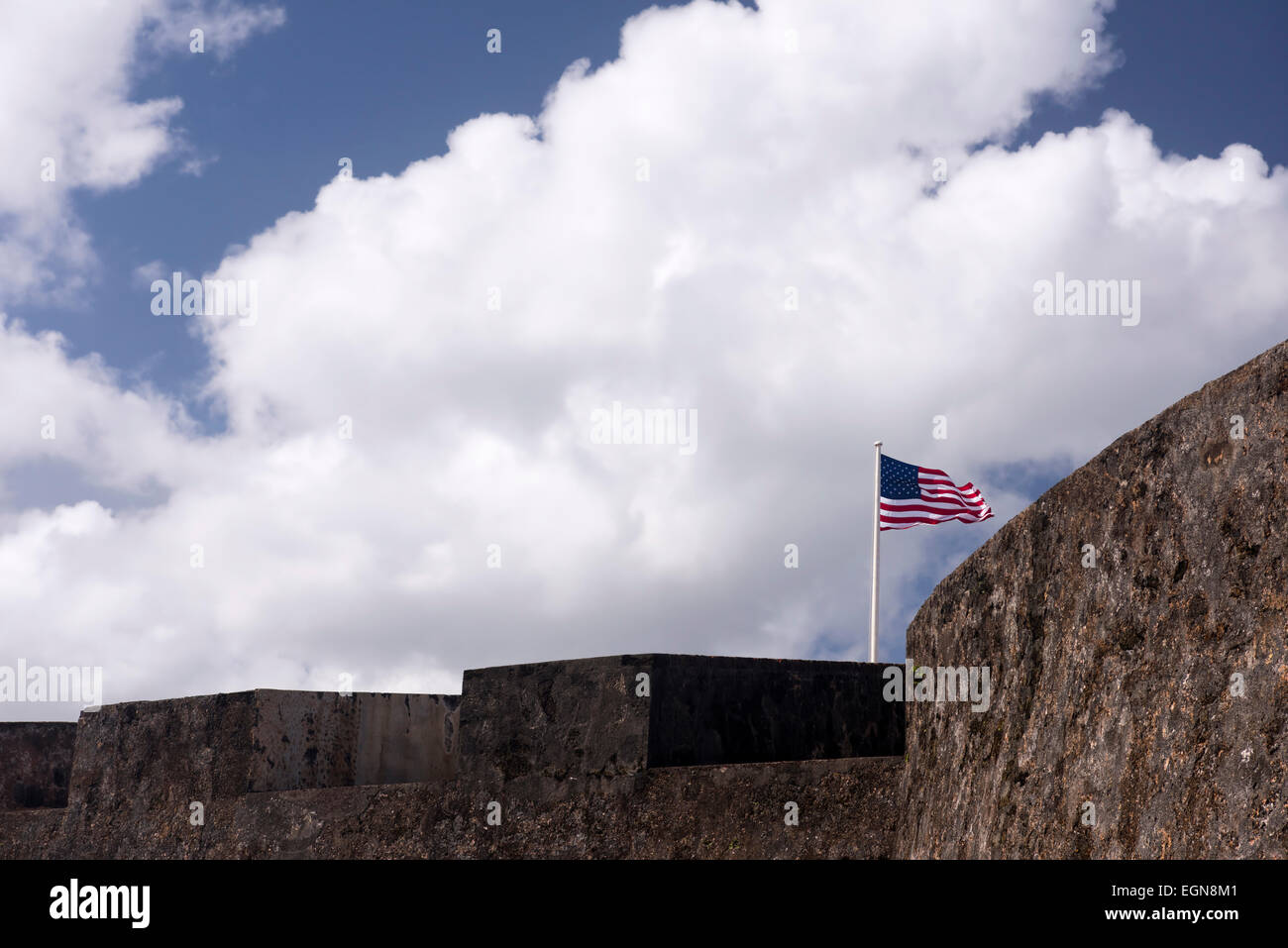 American flag proudly waving over historic military fort Stock Photo ...