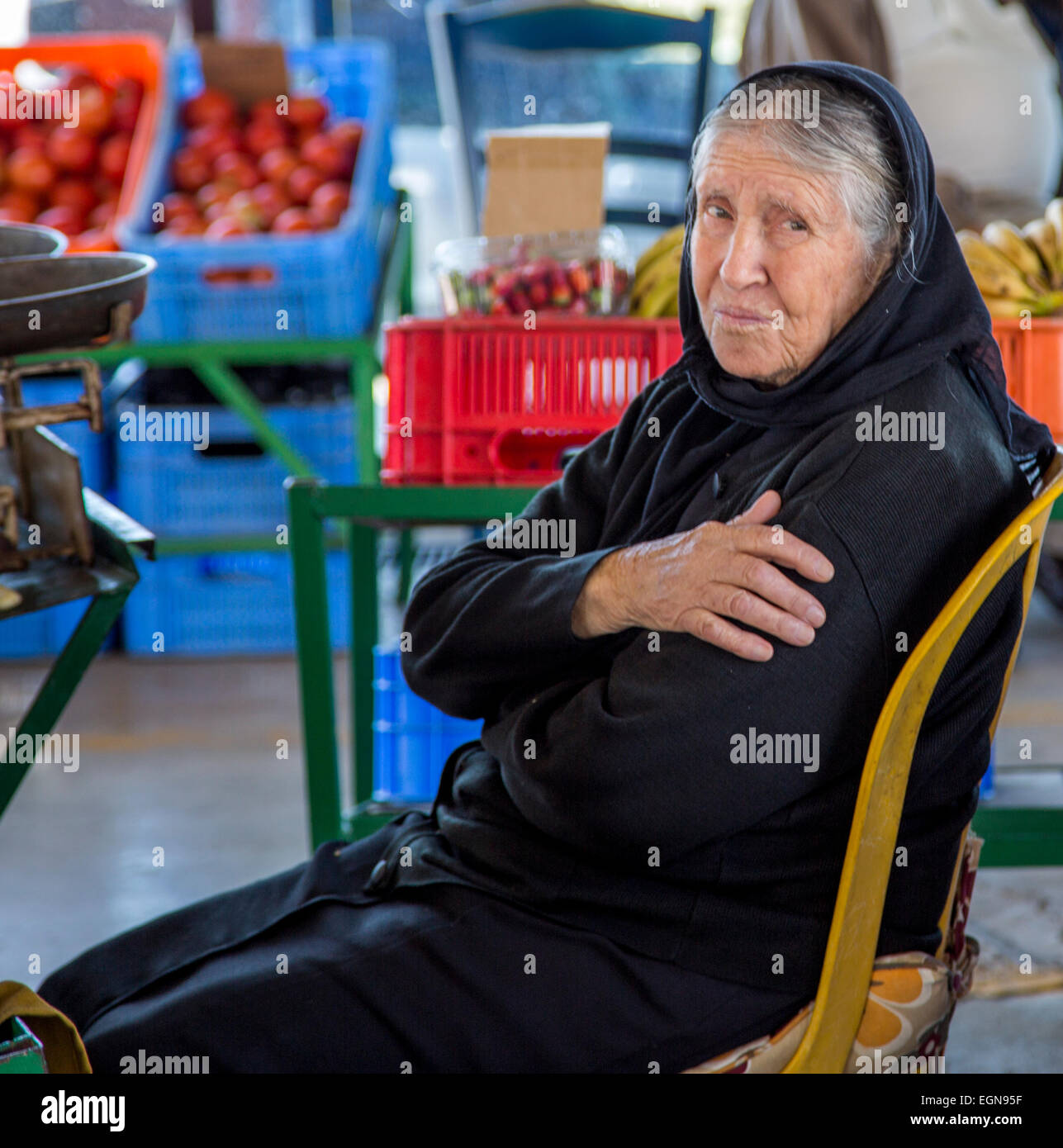 Lady vegetable market stall holder in the market in Paphos Old Town ...