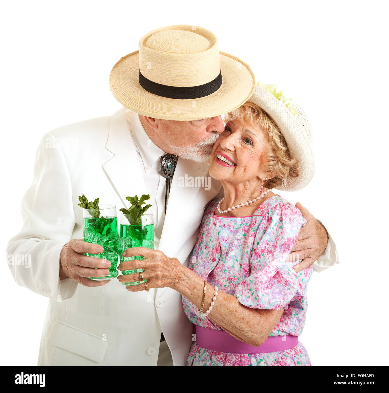 Southern senior couple dressed for the Kentucky Derby, holding mint ...