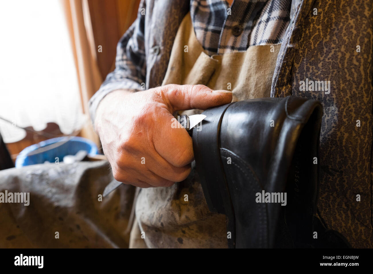 Cobbler mending shoe hi-res stock photography and images - Alamy