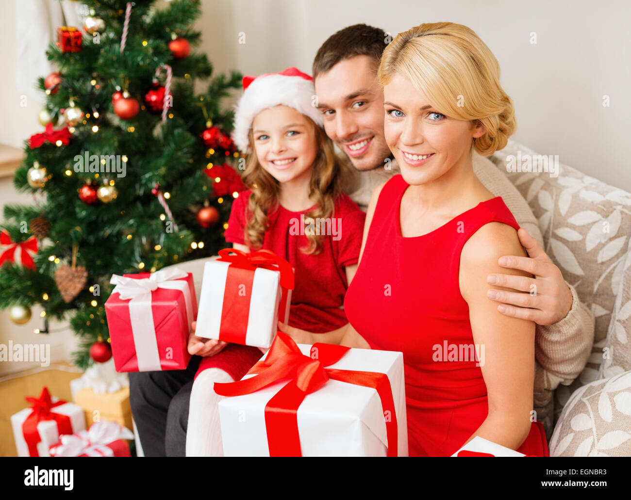 smiling family holding many gift boxes Stock Photo - Alamy