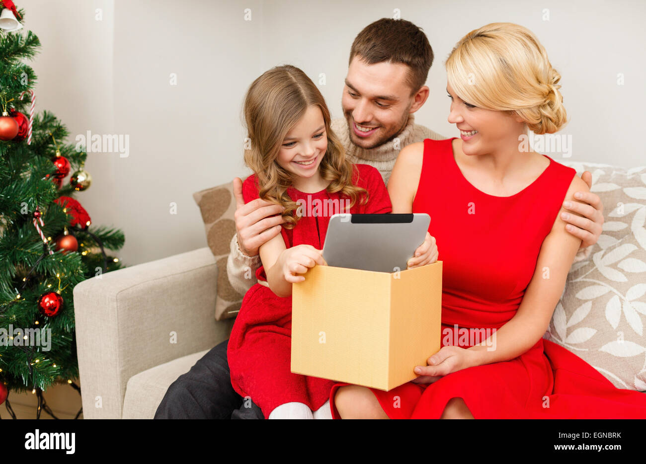 smiling family with tablet pc Stock Photo - Alamy