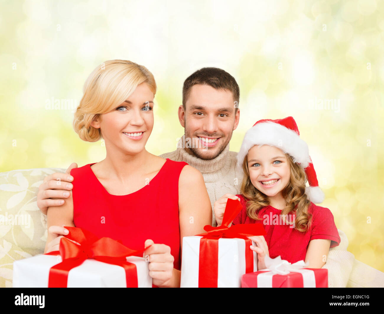 smiling family holding many gift boxes Stock Photo - Alamy