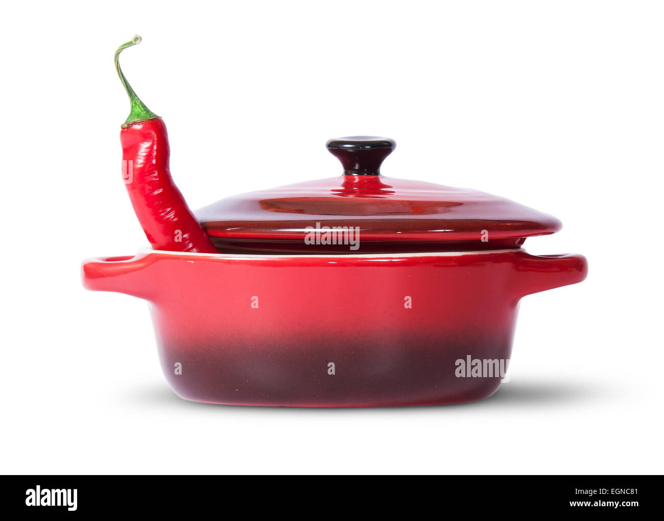 In front red chili pepper in saucepan with lid isolated on white ...