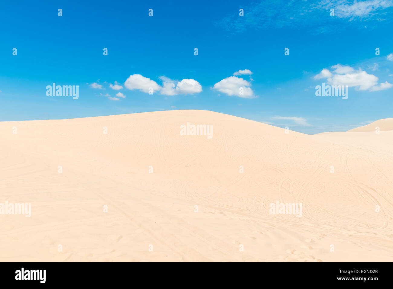 Desert sand dunes landscape with deep blue sky and clouds Stock Photo ...